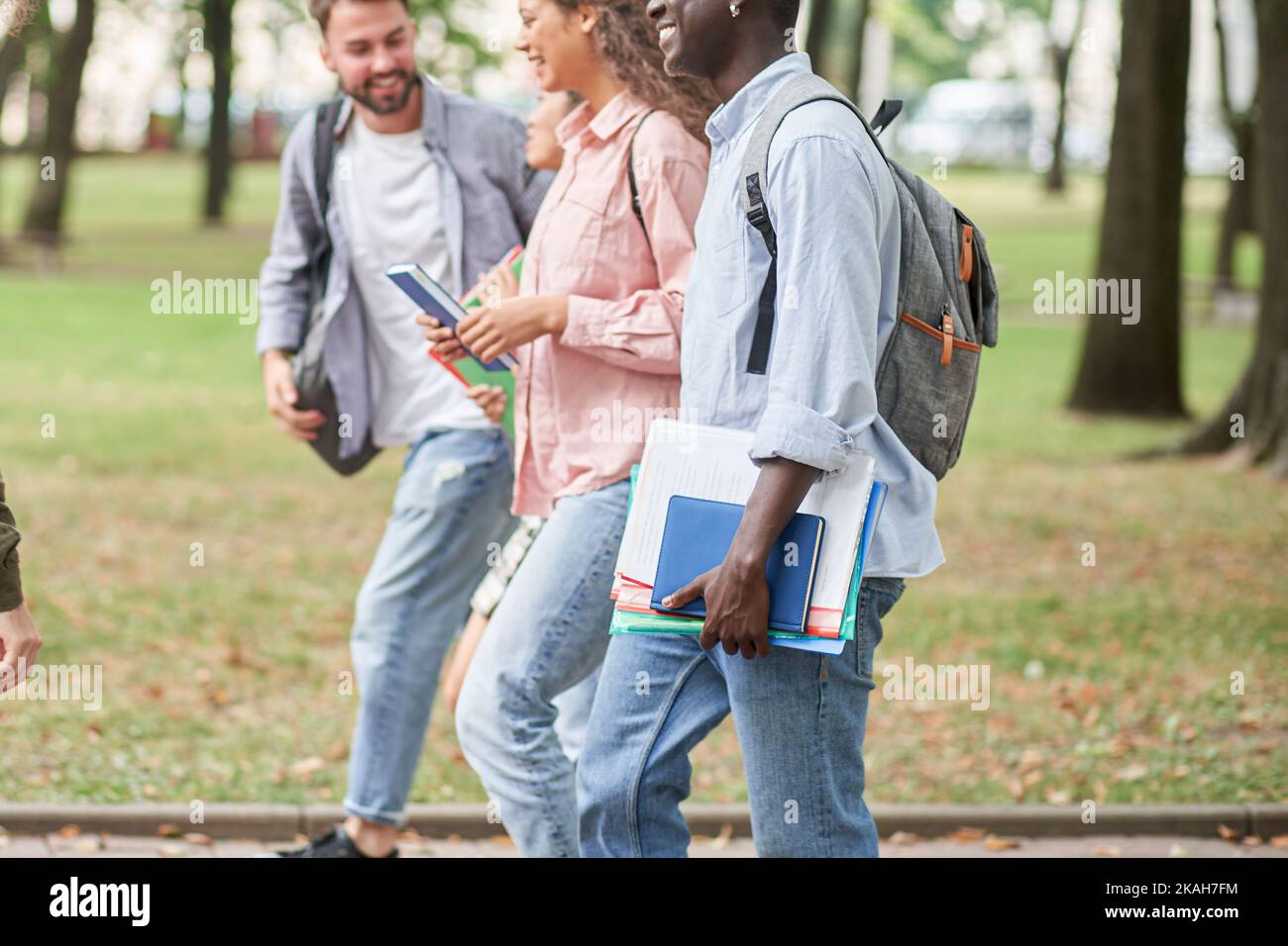 multi - ethnic group of young people walking together Stock Photo - Alamy