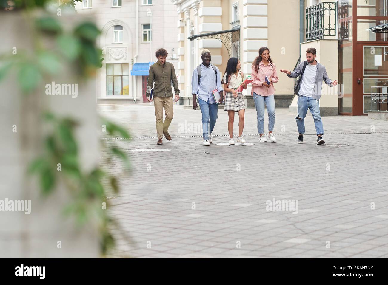 Diverse group walking down street hi-res stock photography and images ...