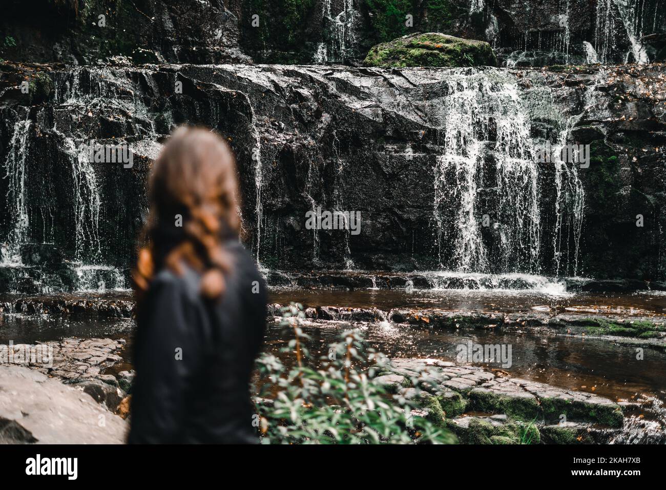 defocused brunette caucasian girl from back contemplating the nice ...
