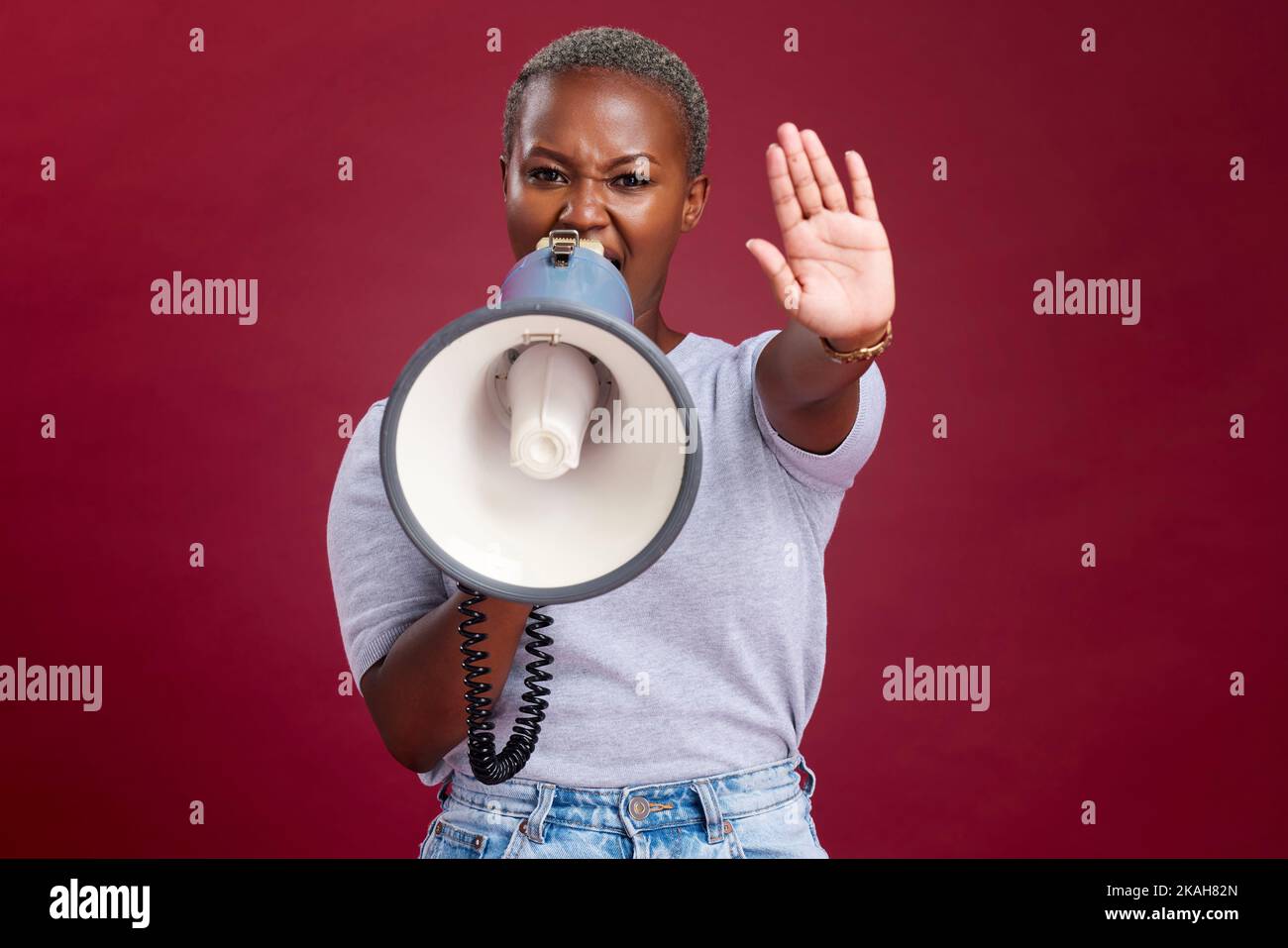 Black woman, protest and shouting with megaphone for voice, strike or ...