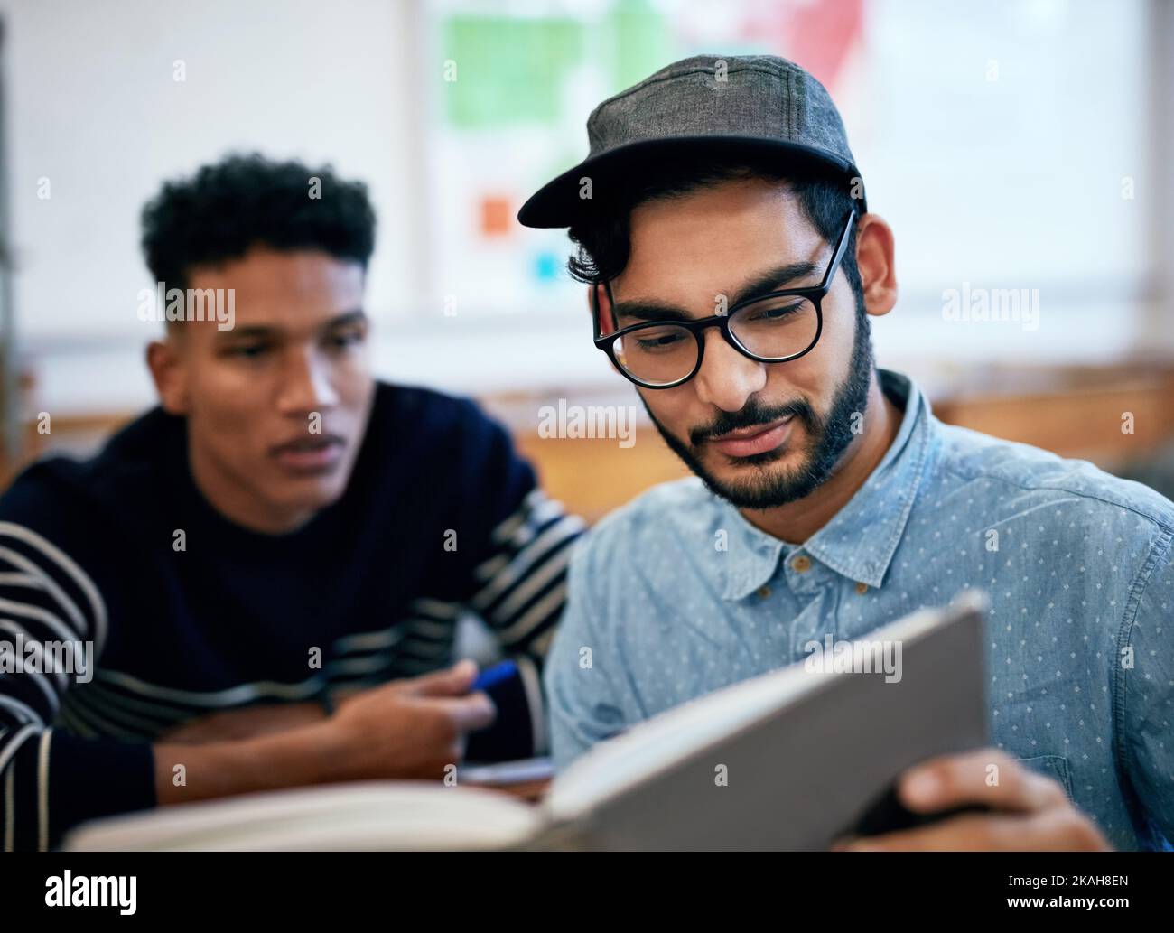 Studying means you trying. university students studying together in ...