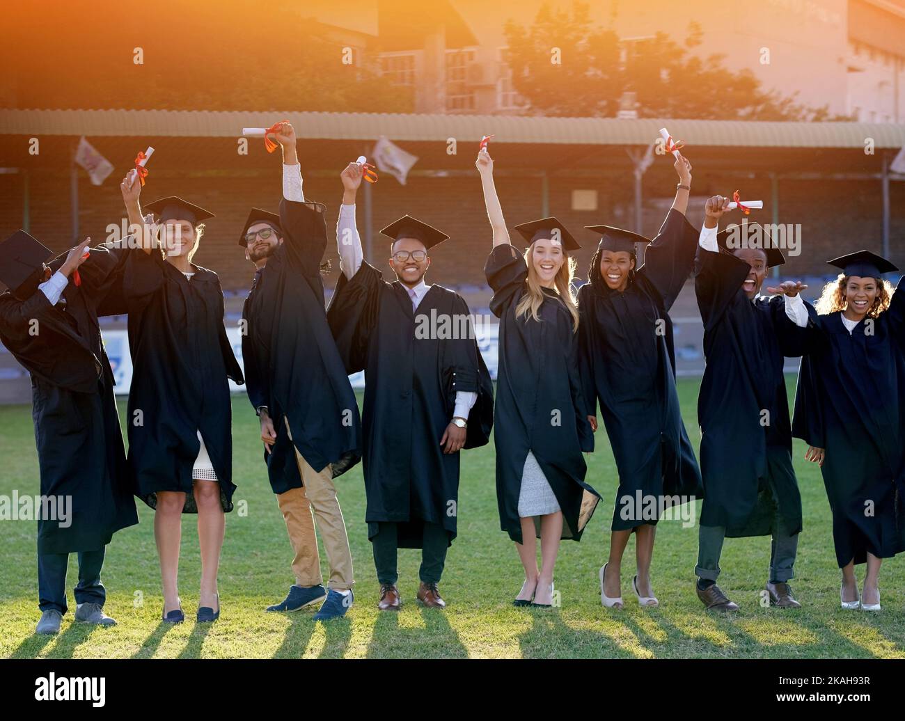 Celebrating a big moment together. Portrait of a group of university ...