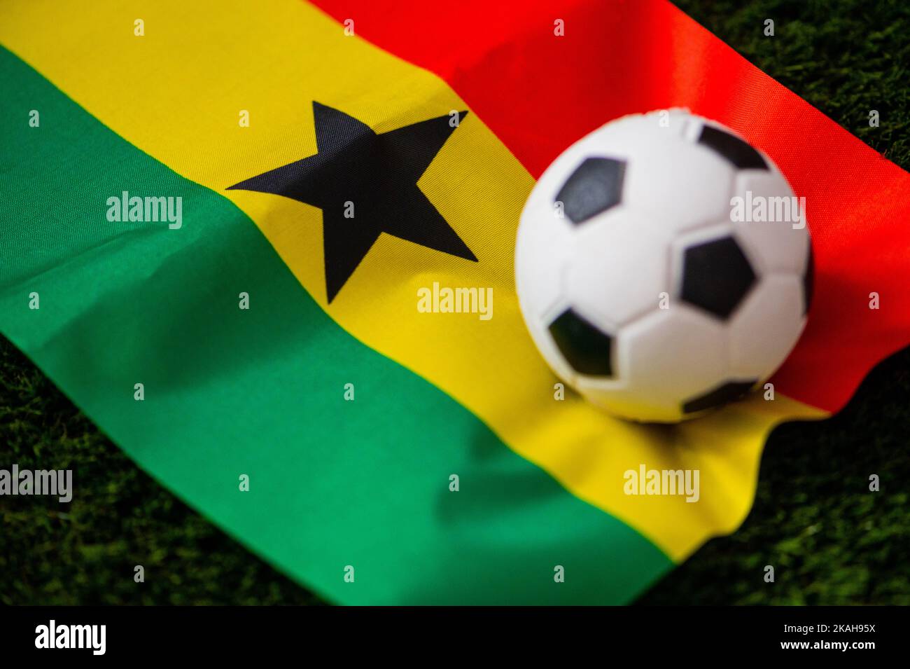 Ghana national football team. National Flag on green grass and soccer ...