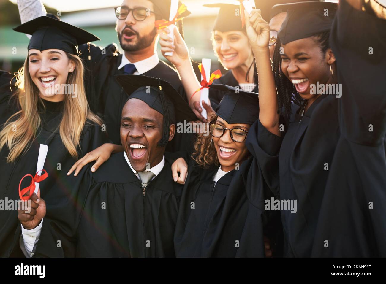 Its graduation time and everyone is so excited. a group of cheerful ...
