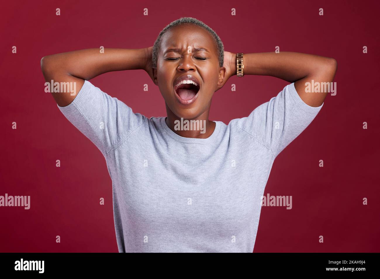 Screaming black woman, angry in studio with hands behind head and sad ...