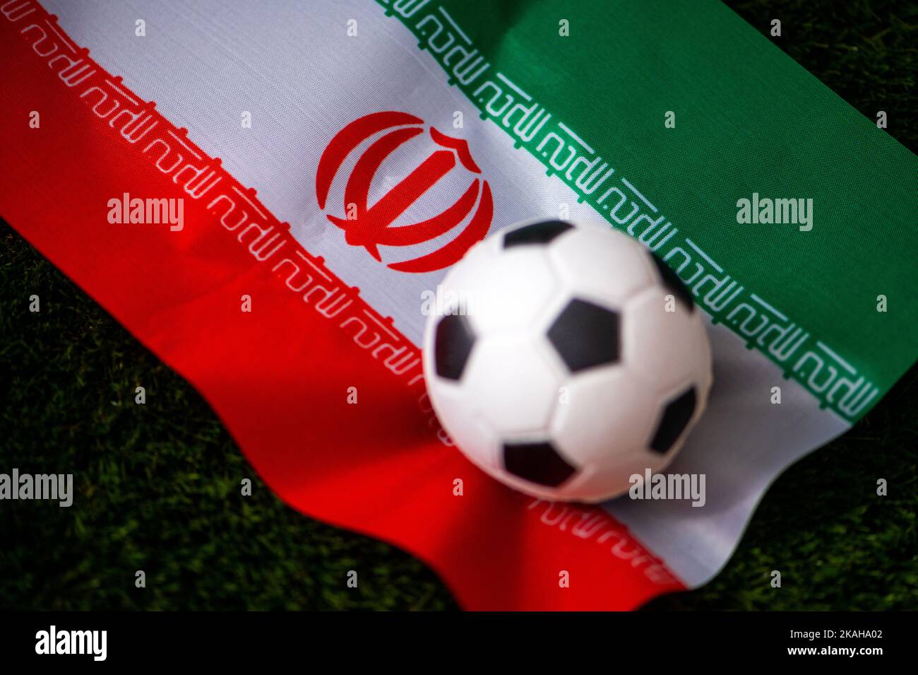 Iran national football team. National Flag on green grass and soccer ...