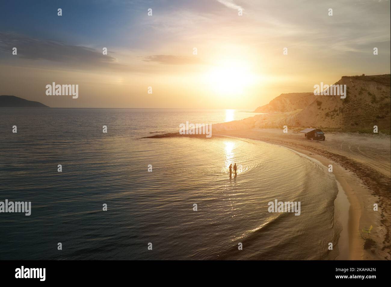 Beautiful woman against sparkling sea hi-res stock photography and ...