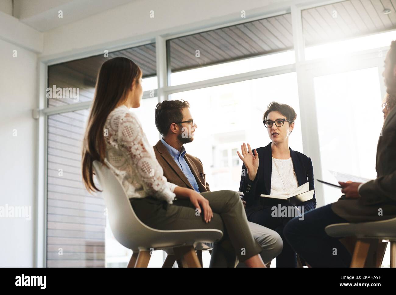 We need to hold off for now. a group of corporate businesspeople ...