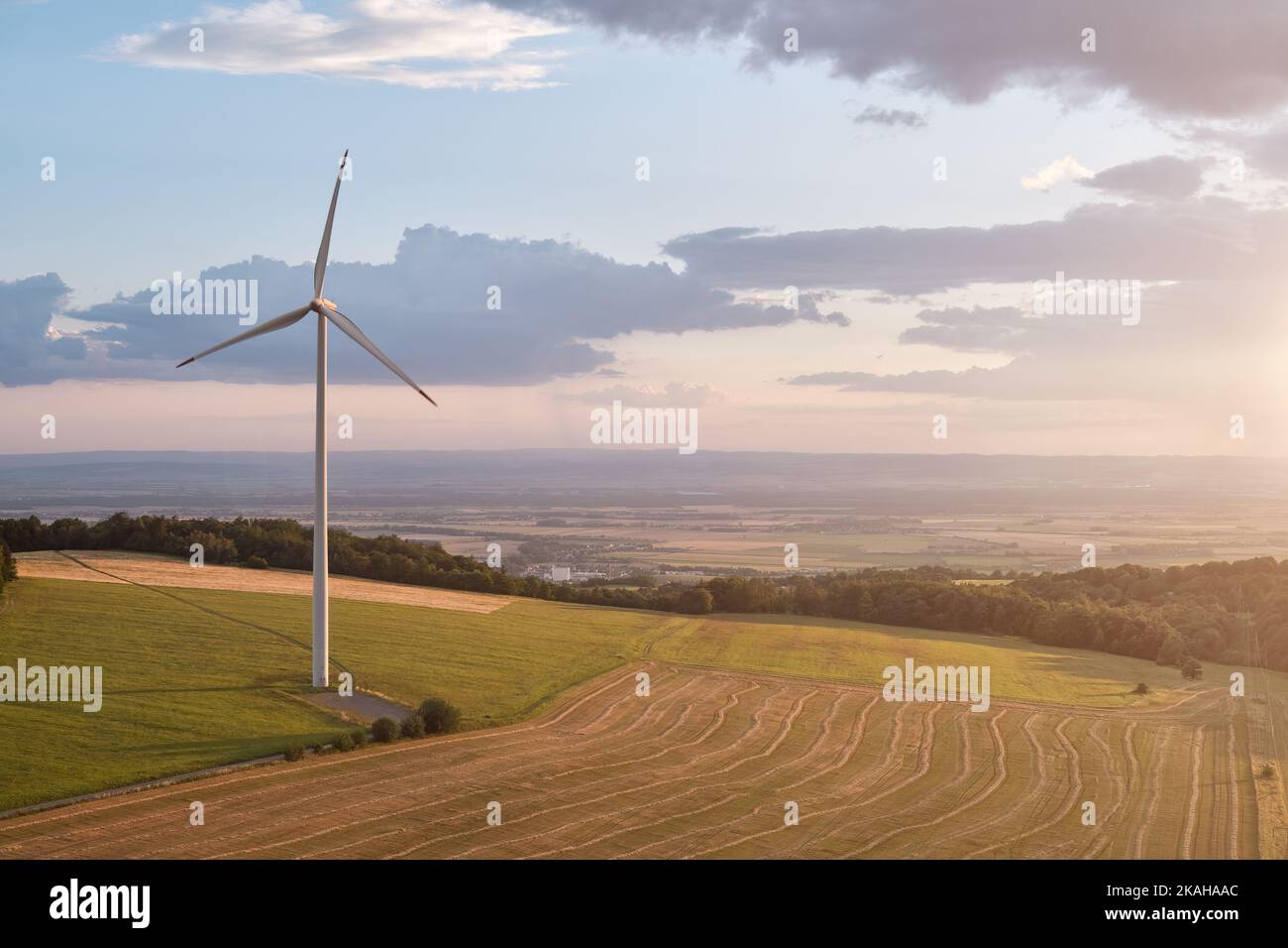 Aerial view of wind power plant in full load, illuminated with dramatic ...