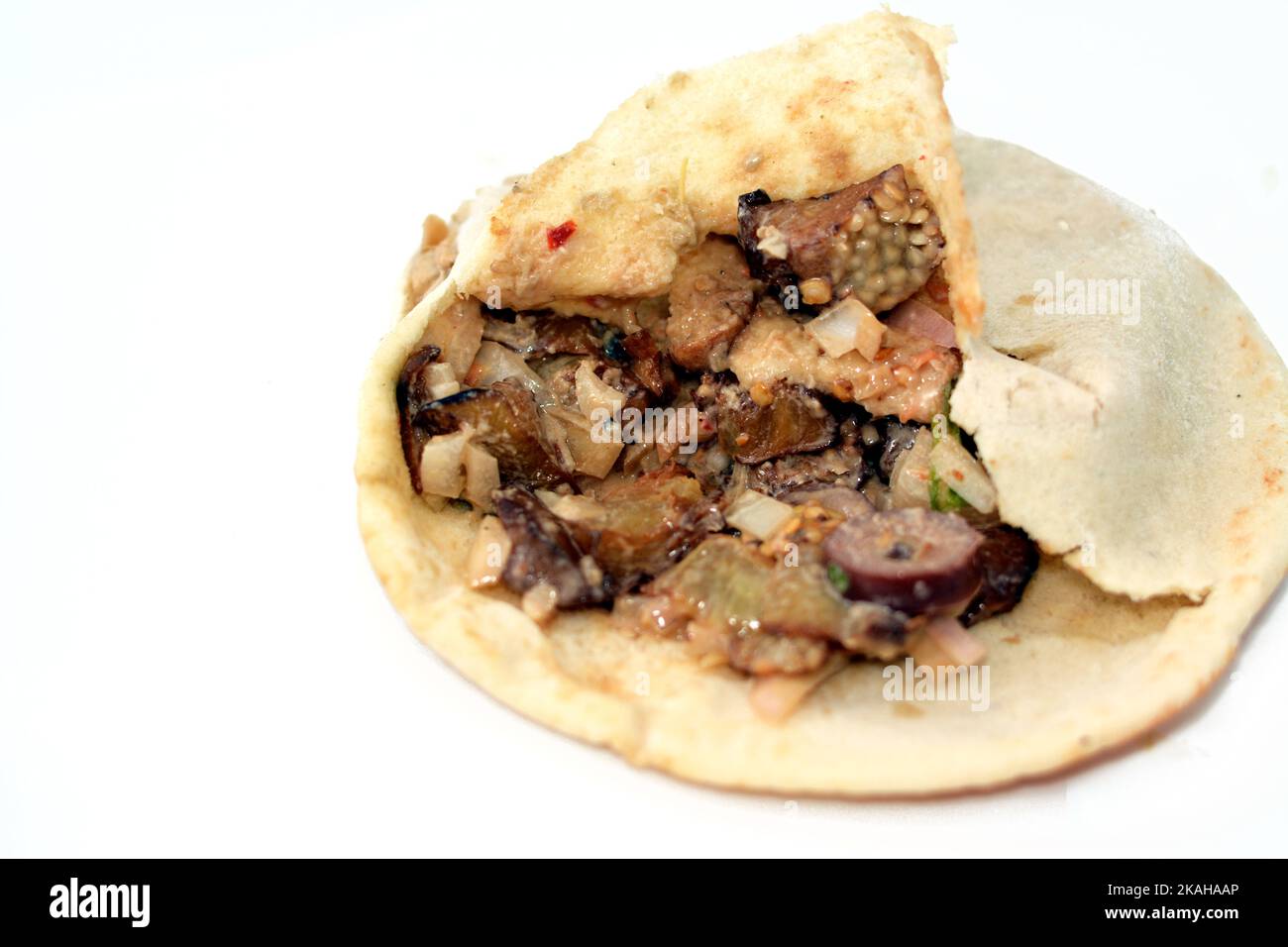 A Shami Syrian pita bread filled with traditional Egyptian Alexandrian ...