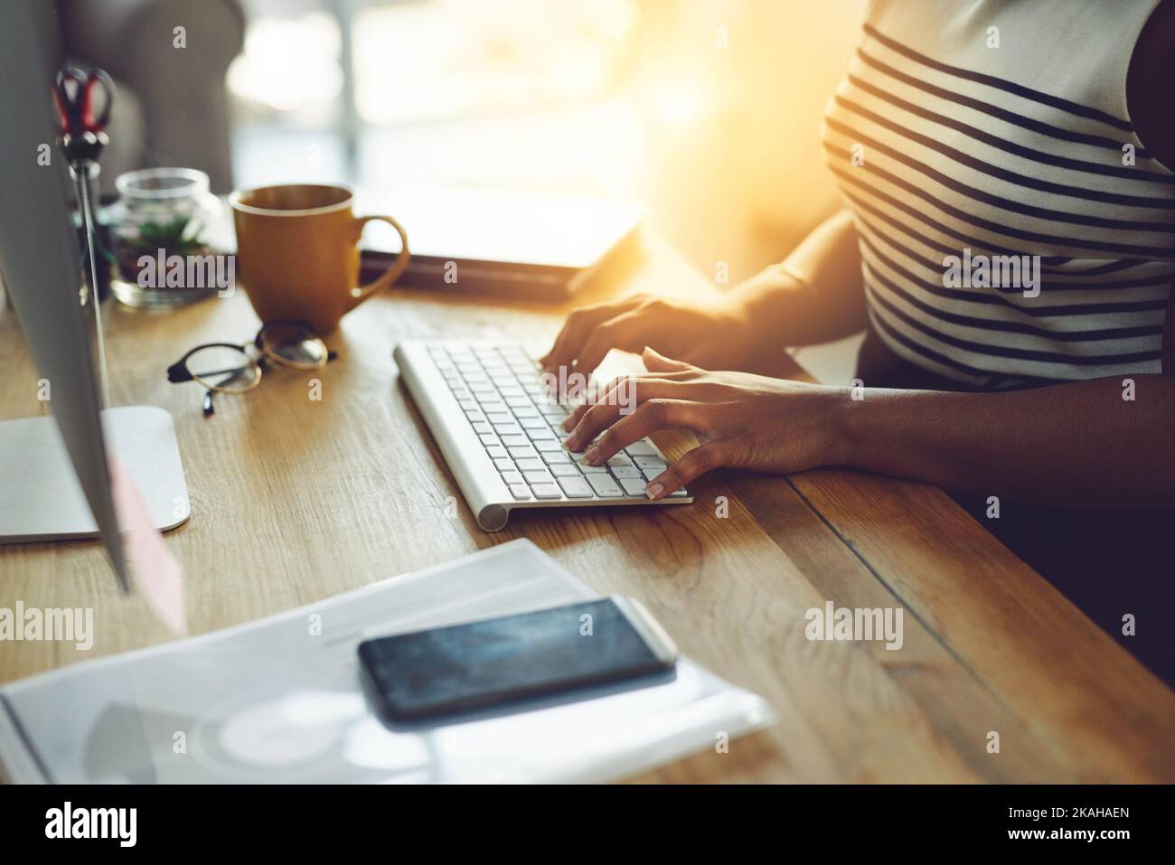 Typing away. an unrecognizable businesswoman typing on a bluetooth ...