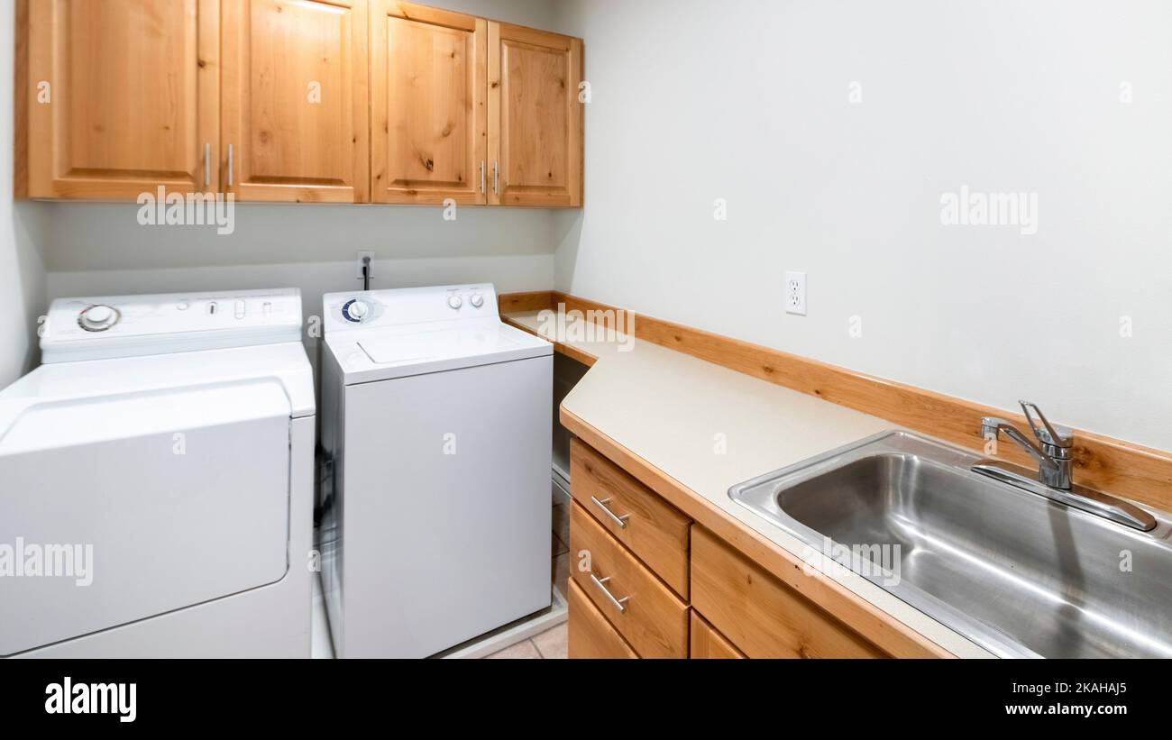 Panorama Craftsman style laundry room with two laundry units. Laundry ...