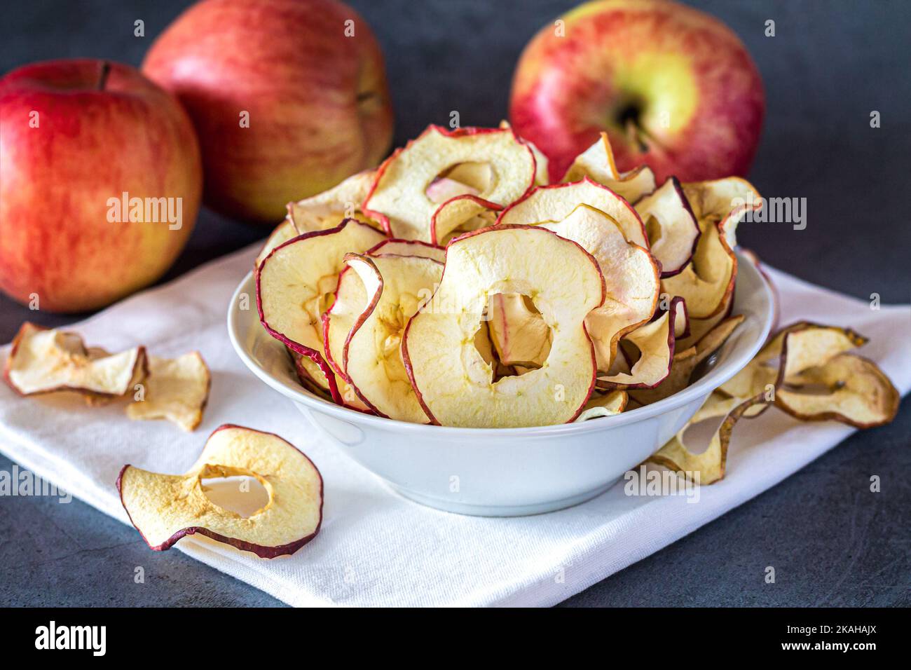 Homemade dried organic apple sliced chips in bowl. Healthy snacks ...