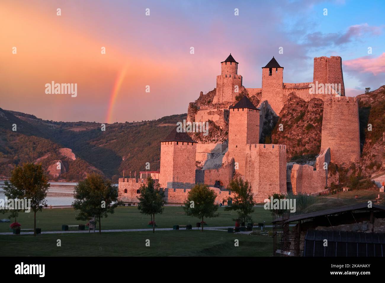 The medieval fortress of Golubac, fortress towers illuminated of pink ...