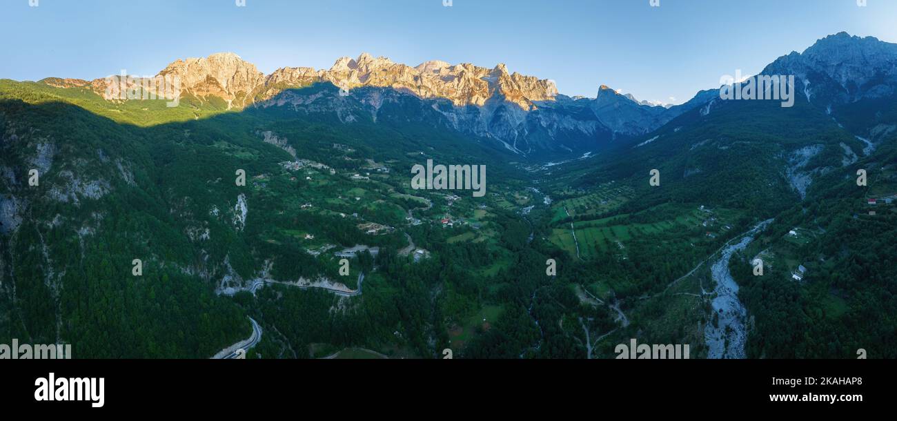 A panoramic, aerial view of the Theth valley during sunset. Hiking ...