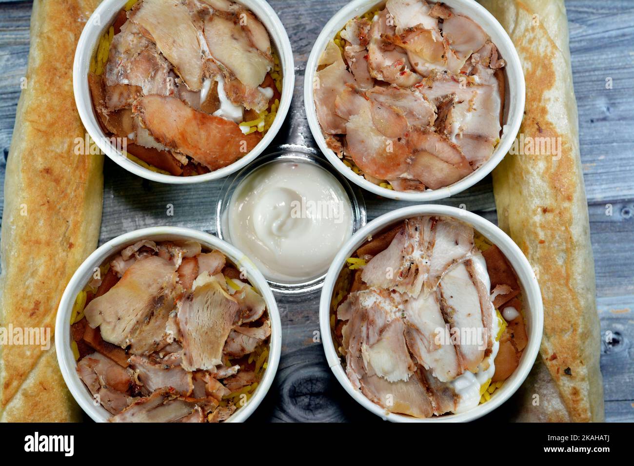 Pieces of Chicken shawarma and yellow Basmati rice, Syrian bread and ...