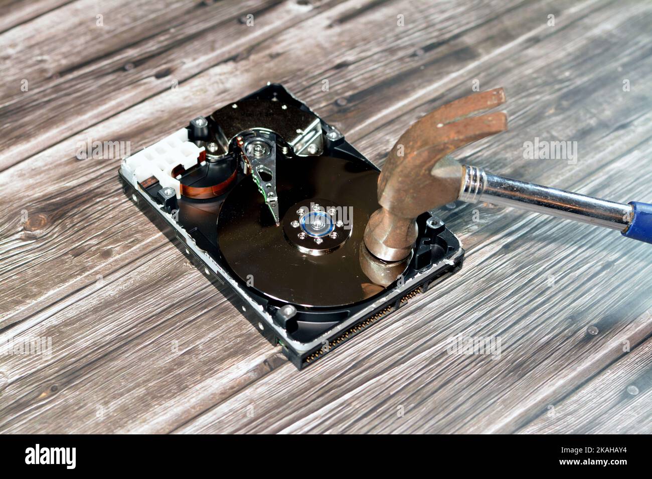 A steel hammer on HDD platters and spindle motor, hard disk drive ... A steel hammer on HDD platters and spindle motor, hard disk drive ...
