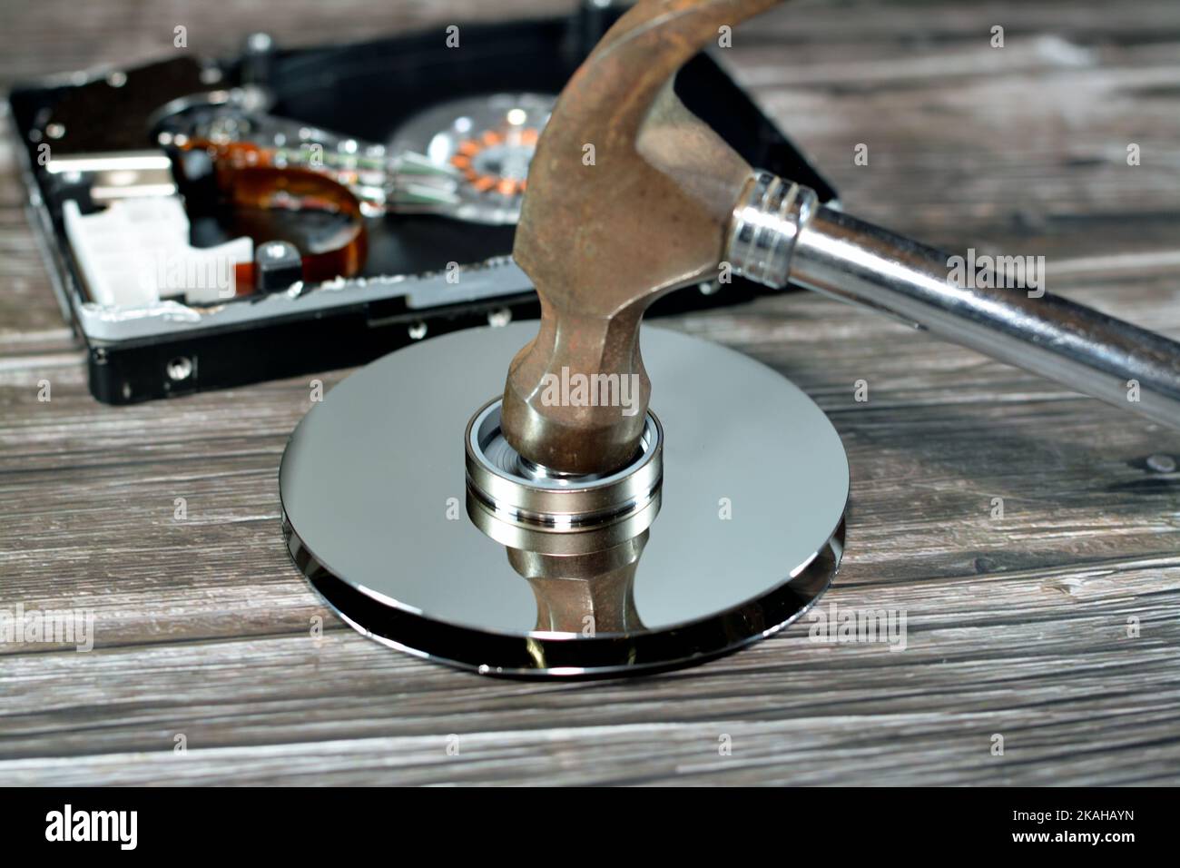 A steel hammer on HDD platters and spindle motor, hard disk drive ...