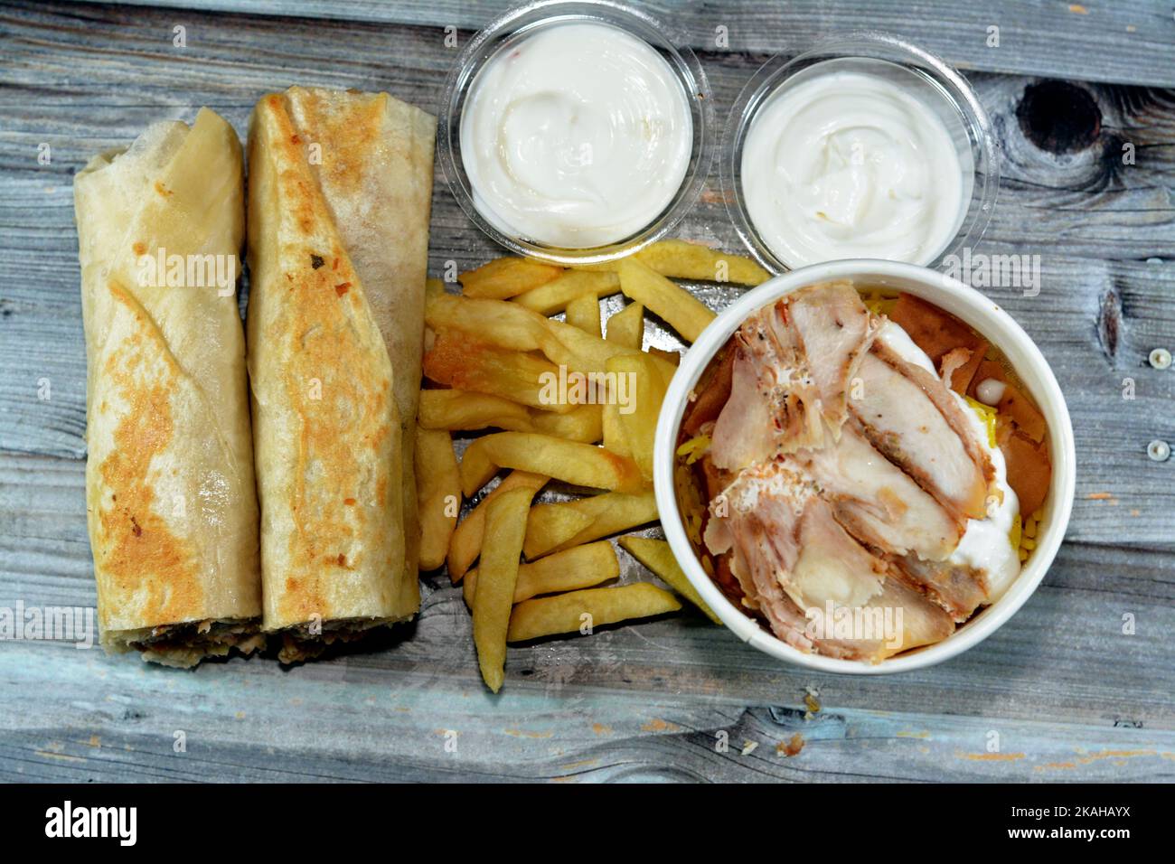 Pieces of Chicken shawarma and yellow Basmati rice, Syrian bread and ...