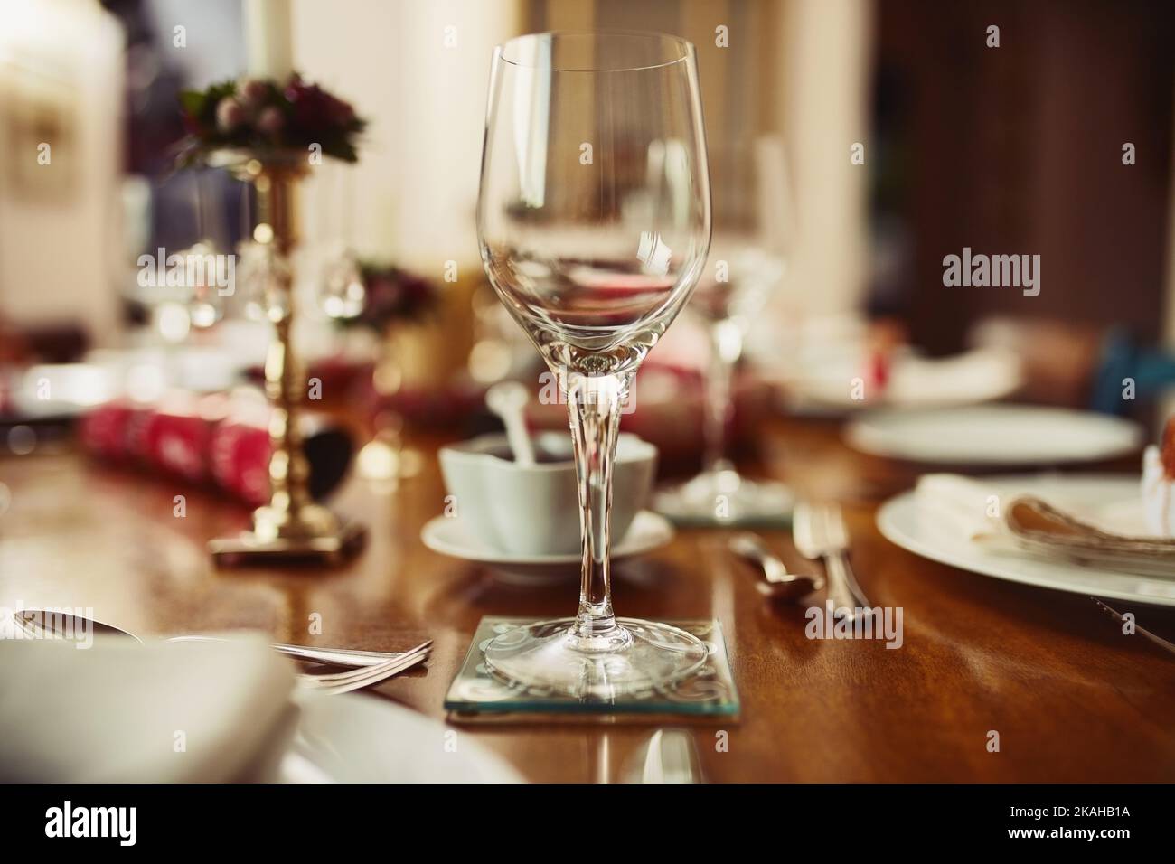 Wining and dining. Closeup shot of a wineglass on a table during ...