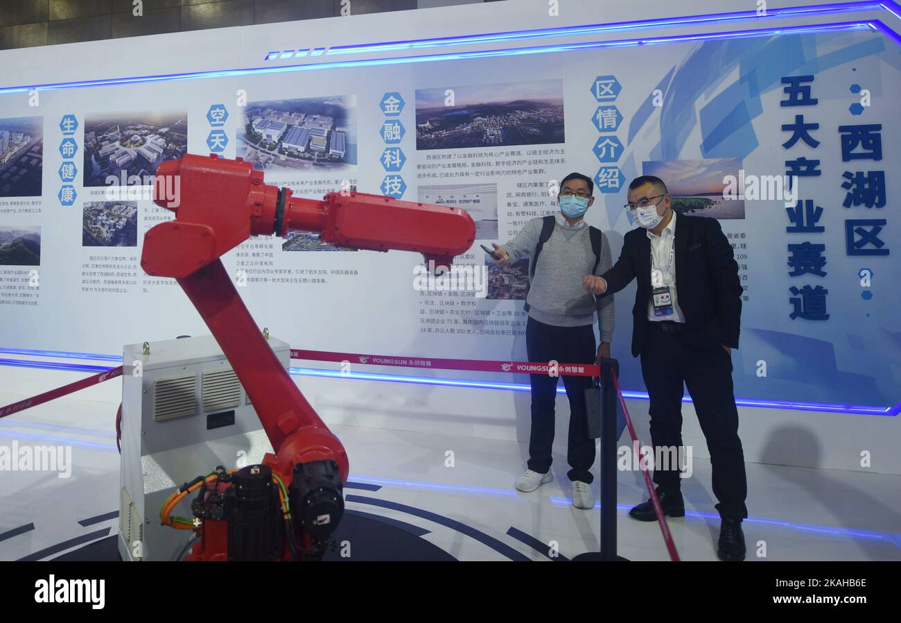 HANGZHOU, CHINA - NOVEMBER 3, 2022 - Spectators view a demonstration of an industrial robot ...