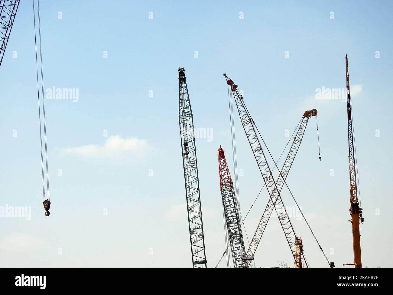 Various mobile wire cranes at a construction site at a factory that ...