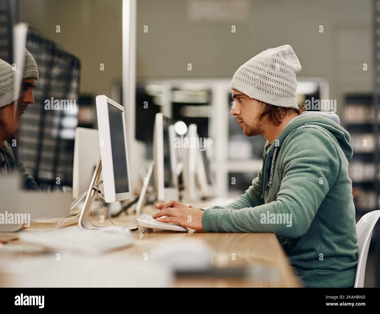 Its exam season. a young male university student studying in the ...