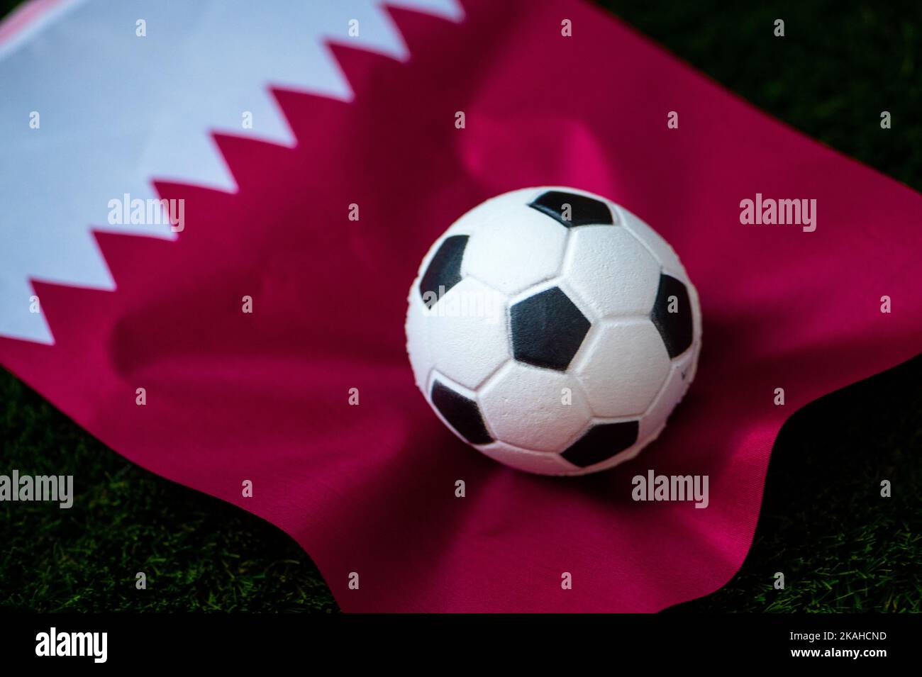 Qatar national football team. National Flag on green grass and soccer ...