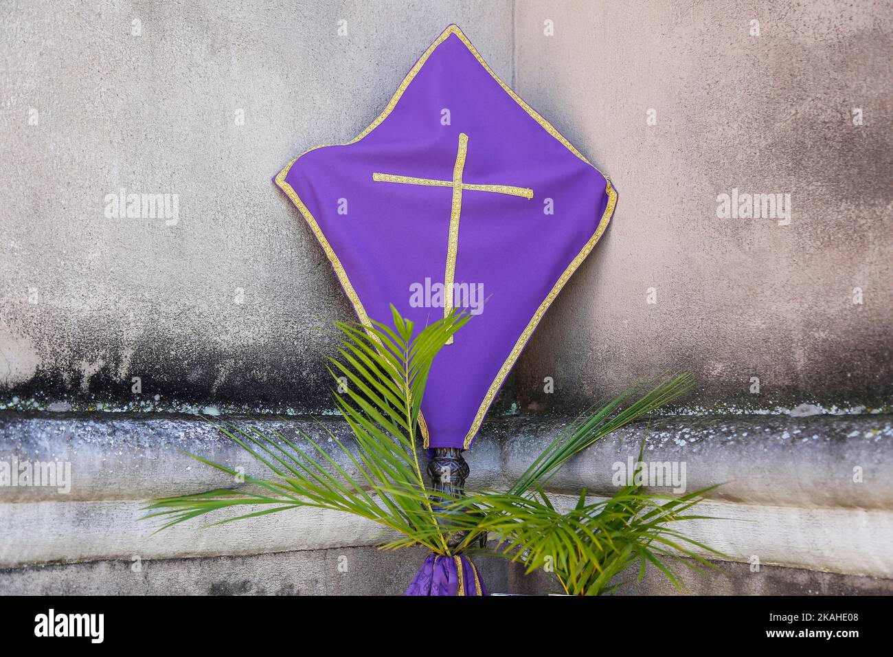Holy Week. Cross covered with purple fabric in the period of lent. Traditional Catholic ...