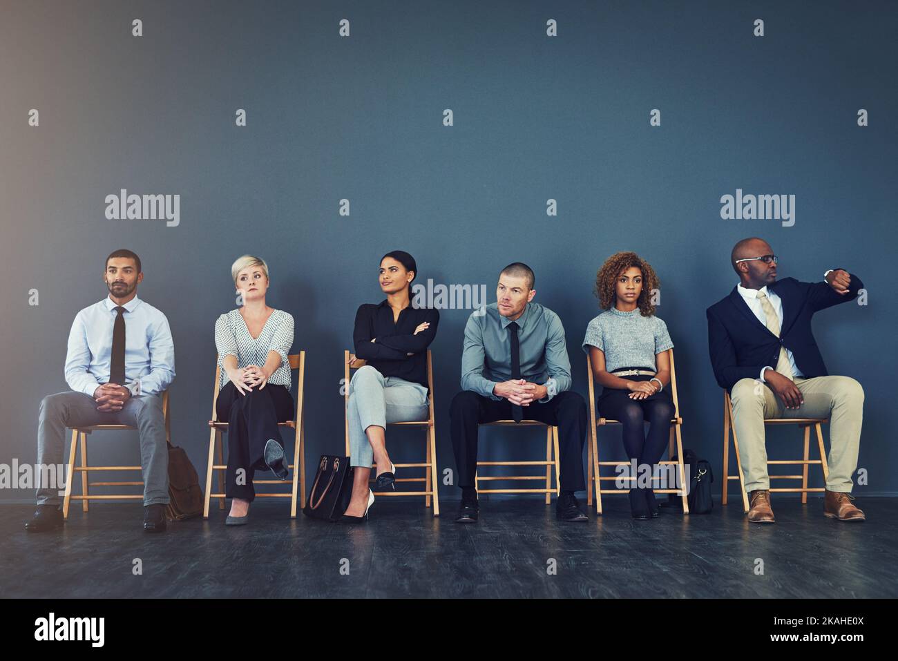 Even the wait is a pre test interview. a group of well dressed ...