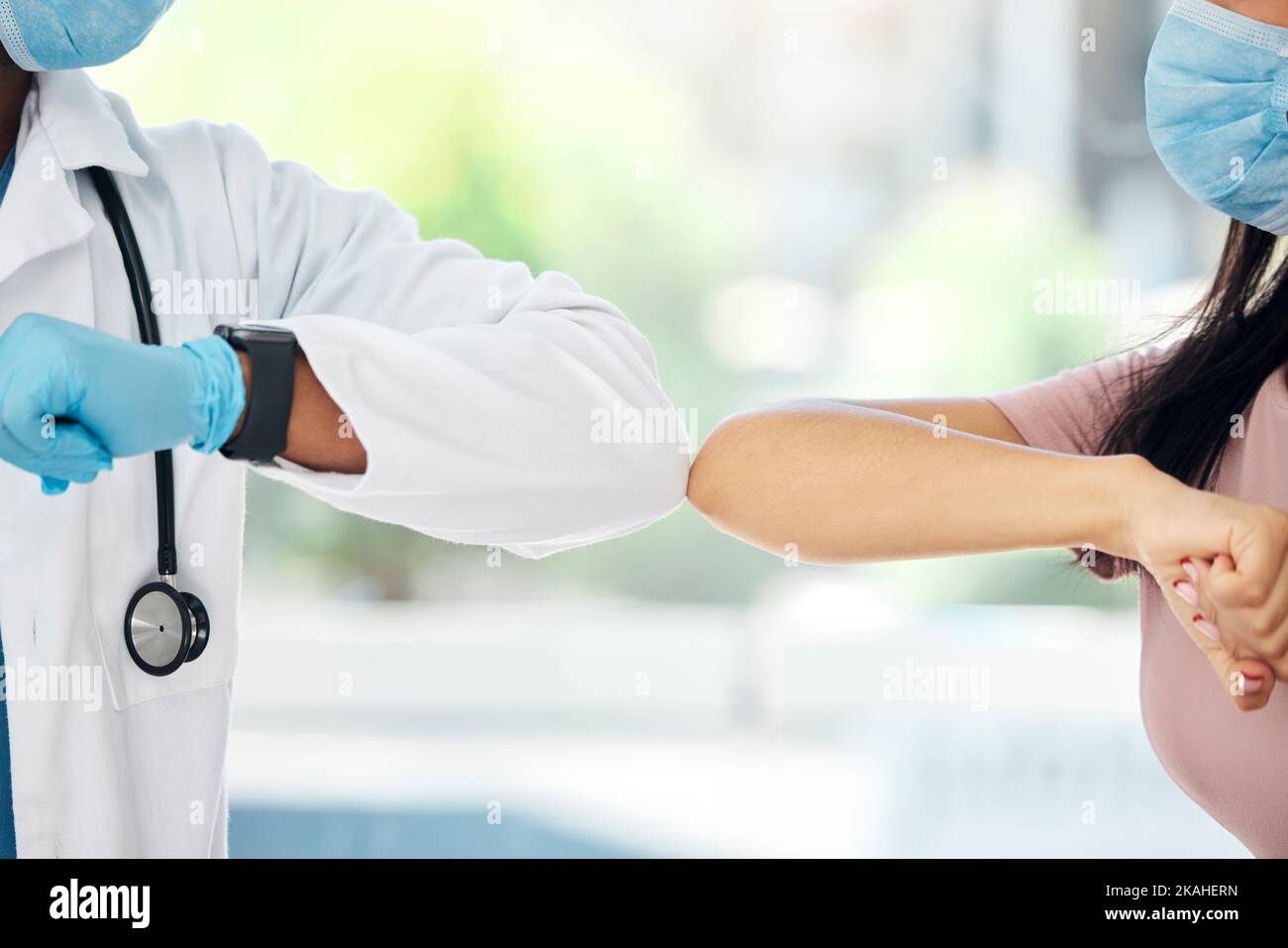Covid, doctor and woman elbow bump hello for covid compliance, safety ...