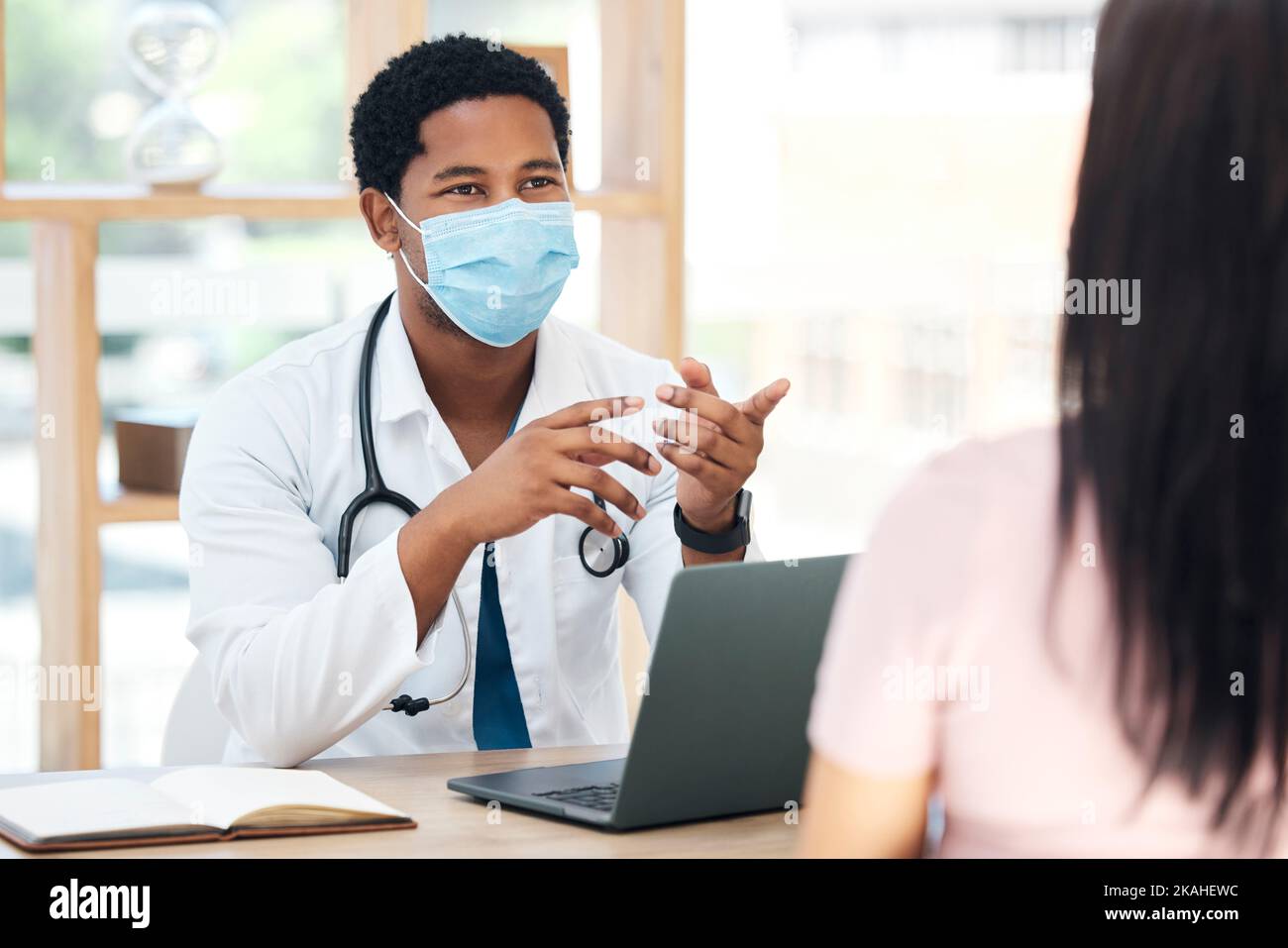 Doctor talking patient hospital office hi-res stock photography and ...