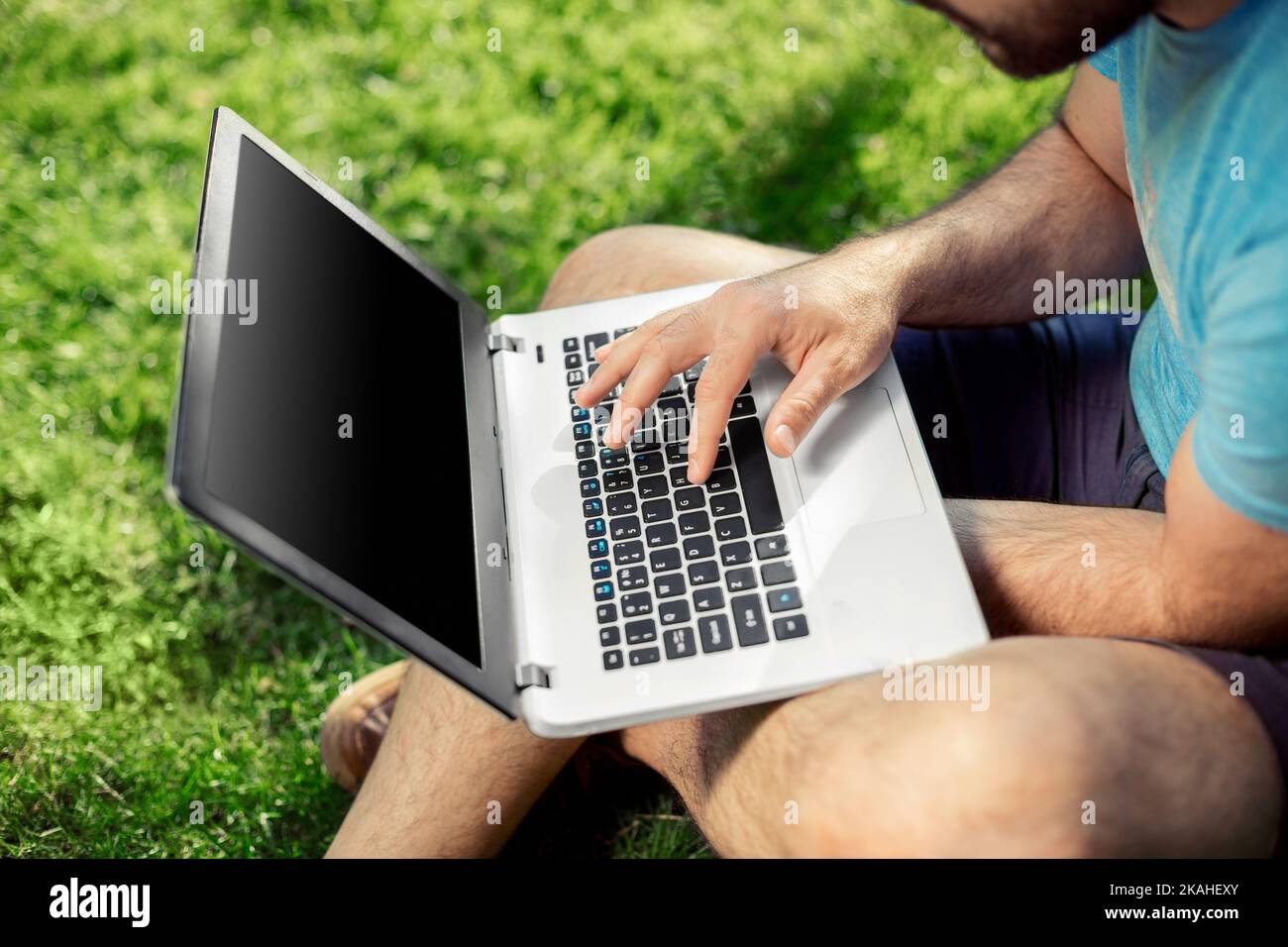 Top view male hands using notebook outdoors in urban setting while ...