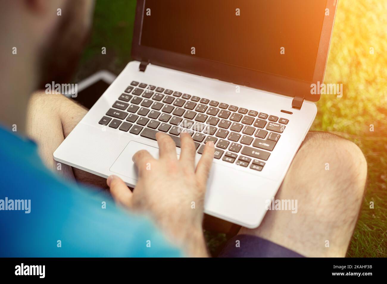Top view male hands using notebook outdoors in urban setting while ...