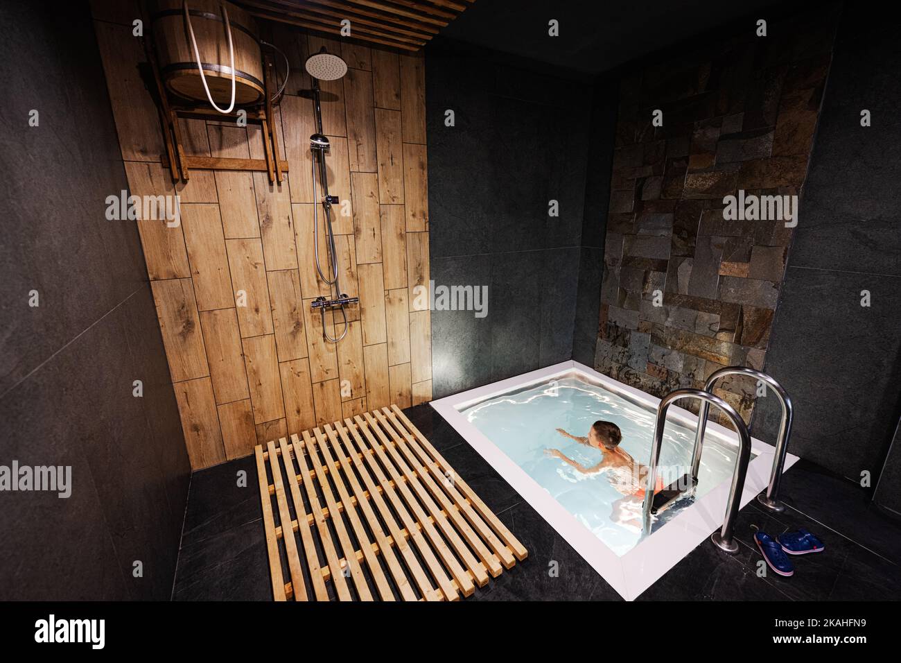 Boy swimming on spa pool at sauna Stock Photo - Alamy