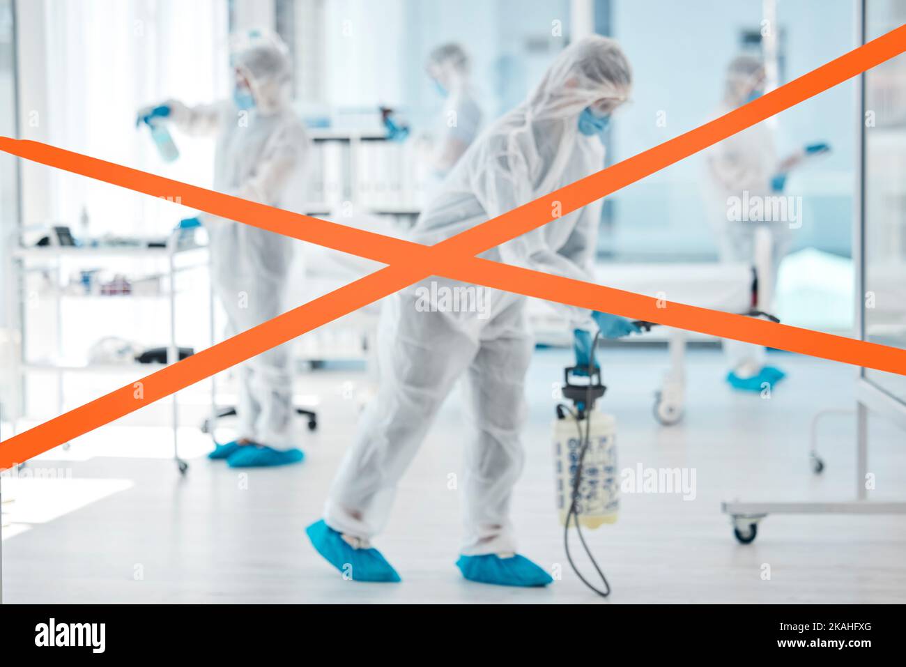 Covid, warning tape and cleaning team using disinfection spray, ppe and ...