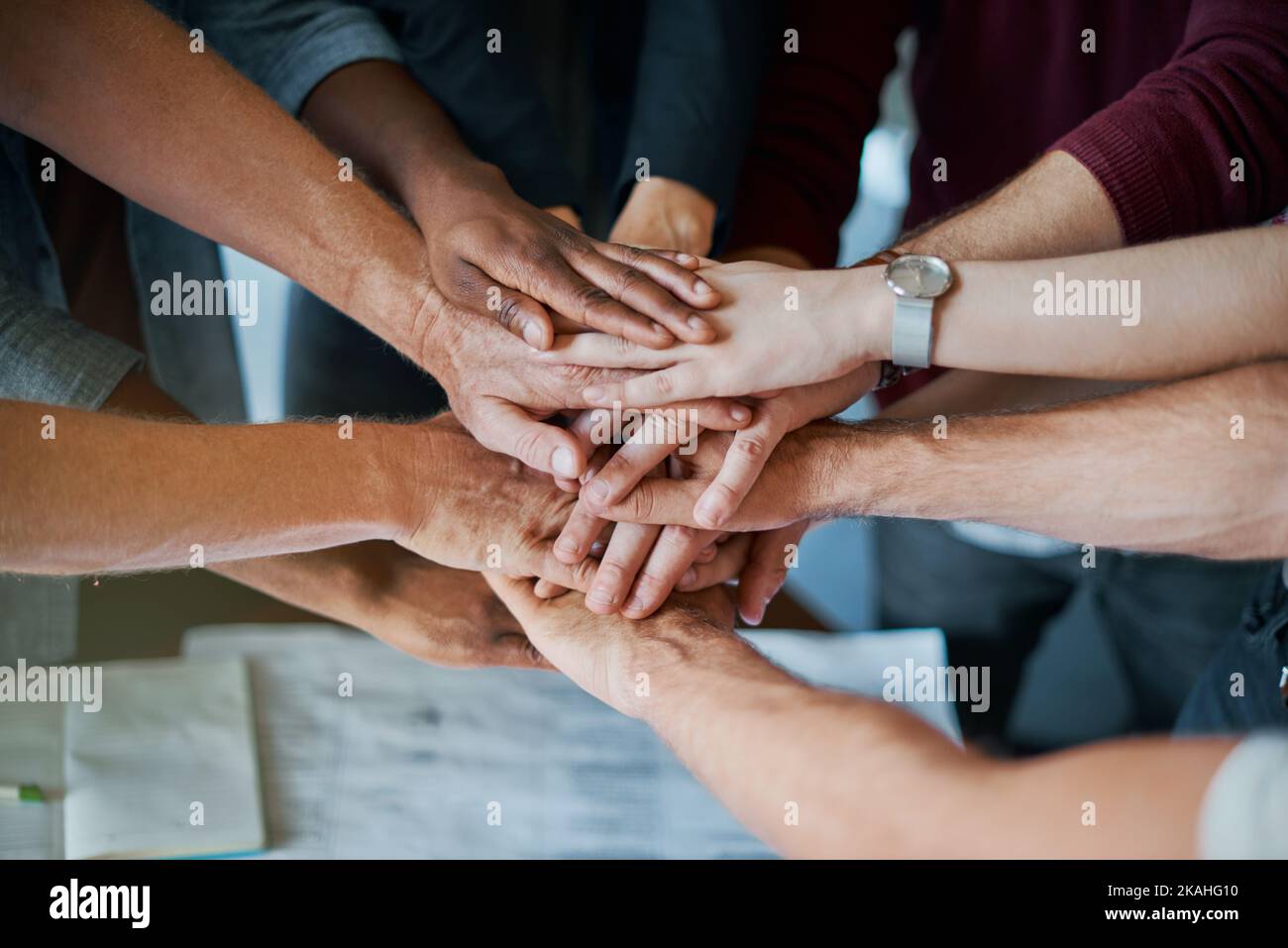 Lets band together as one. a group of unrecognisable businesspeople ...