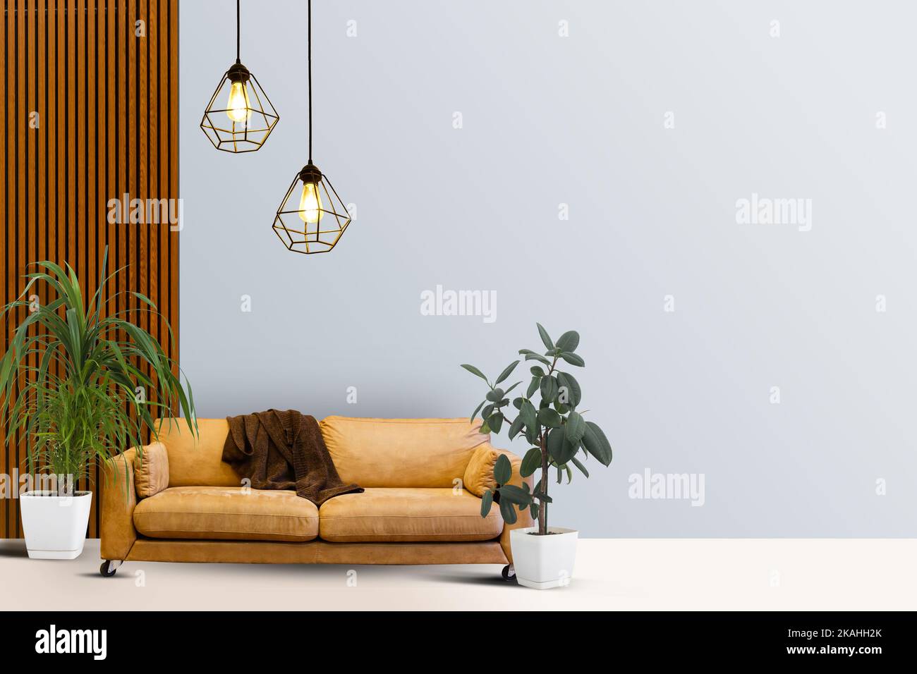 Beige sofa against empty wall with copy space in simple living room ...