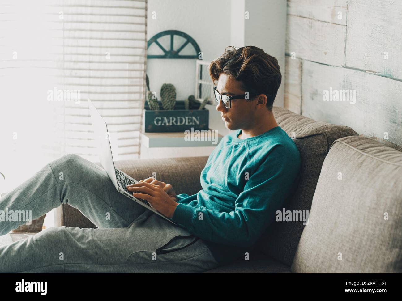 Young boy student age working on laptop in wireless connection for ...