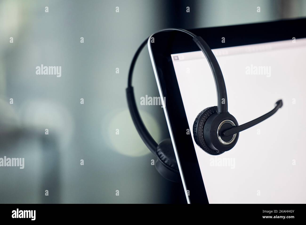 Call center, laptop screen and headset Laptop in modern office for ...