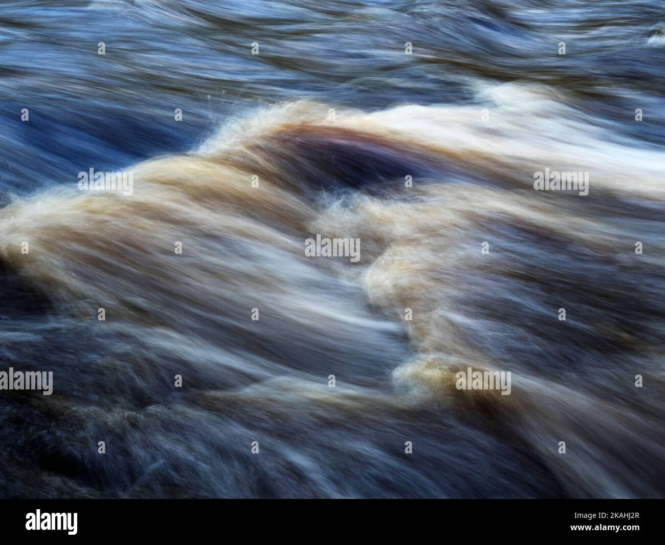 Abstract fast flowing water in the River Nidd in Nidd Gorge Woods ...