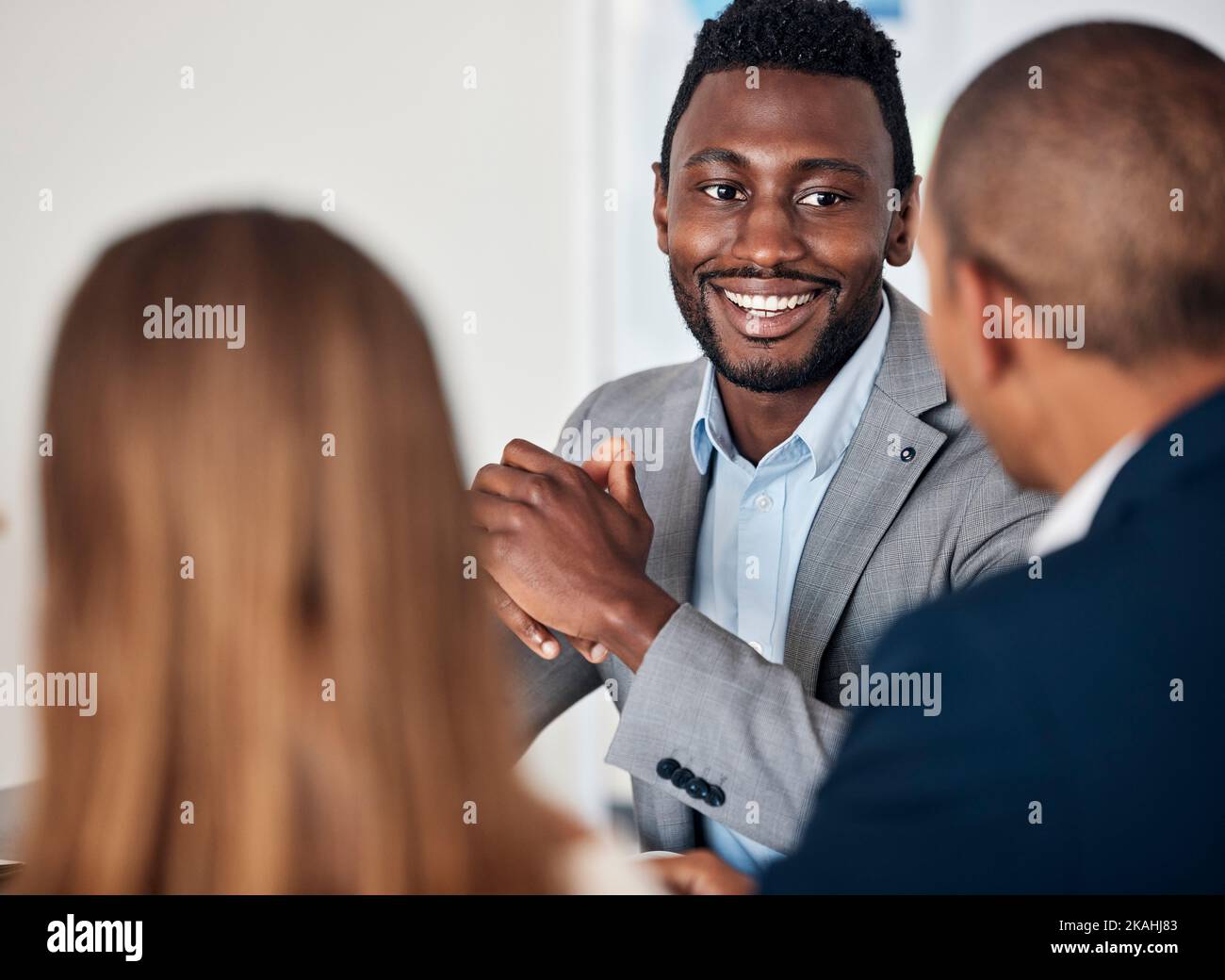 Corporate, smile and black man in a meeting with management for ...