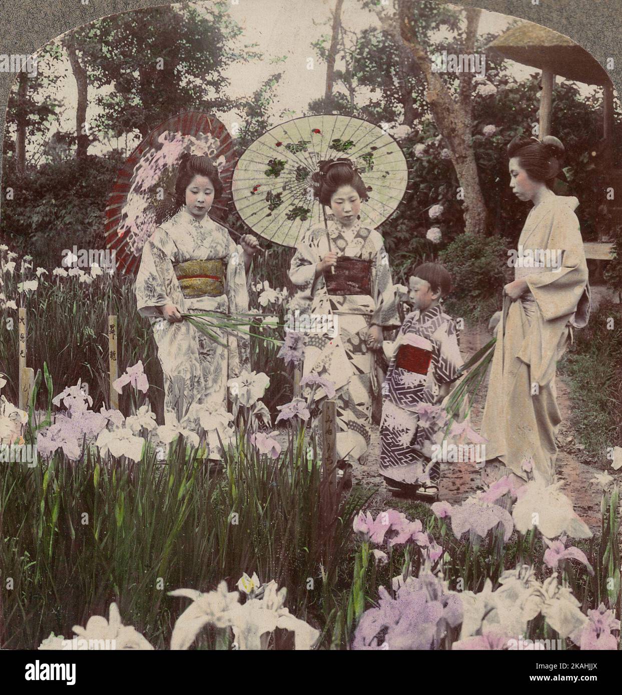 Japan, girls in a garden Stock Photo - Alamy