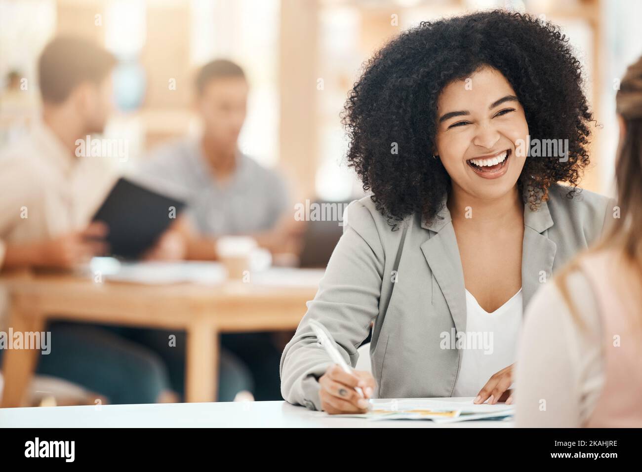 Happy black woman writing notes in office meeting, planning and ...