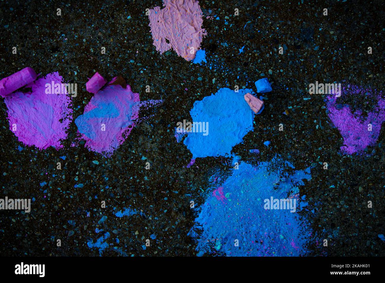 Colorful chalk crayons dissolved on the sidewalk Stock Photo - Alamy