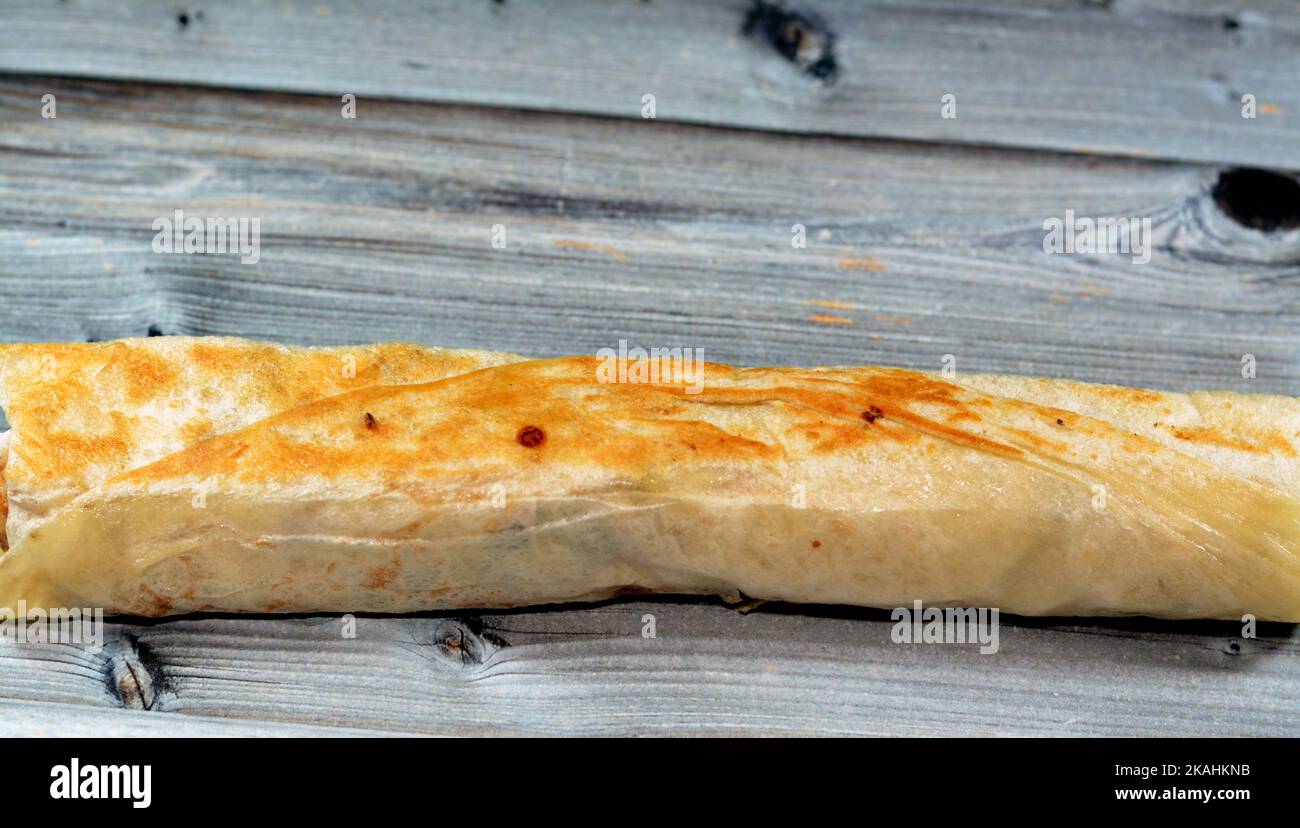 Syrian recipe cuisine background, chicken shawerma or shawarma tortilla ...