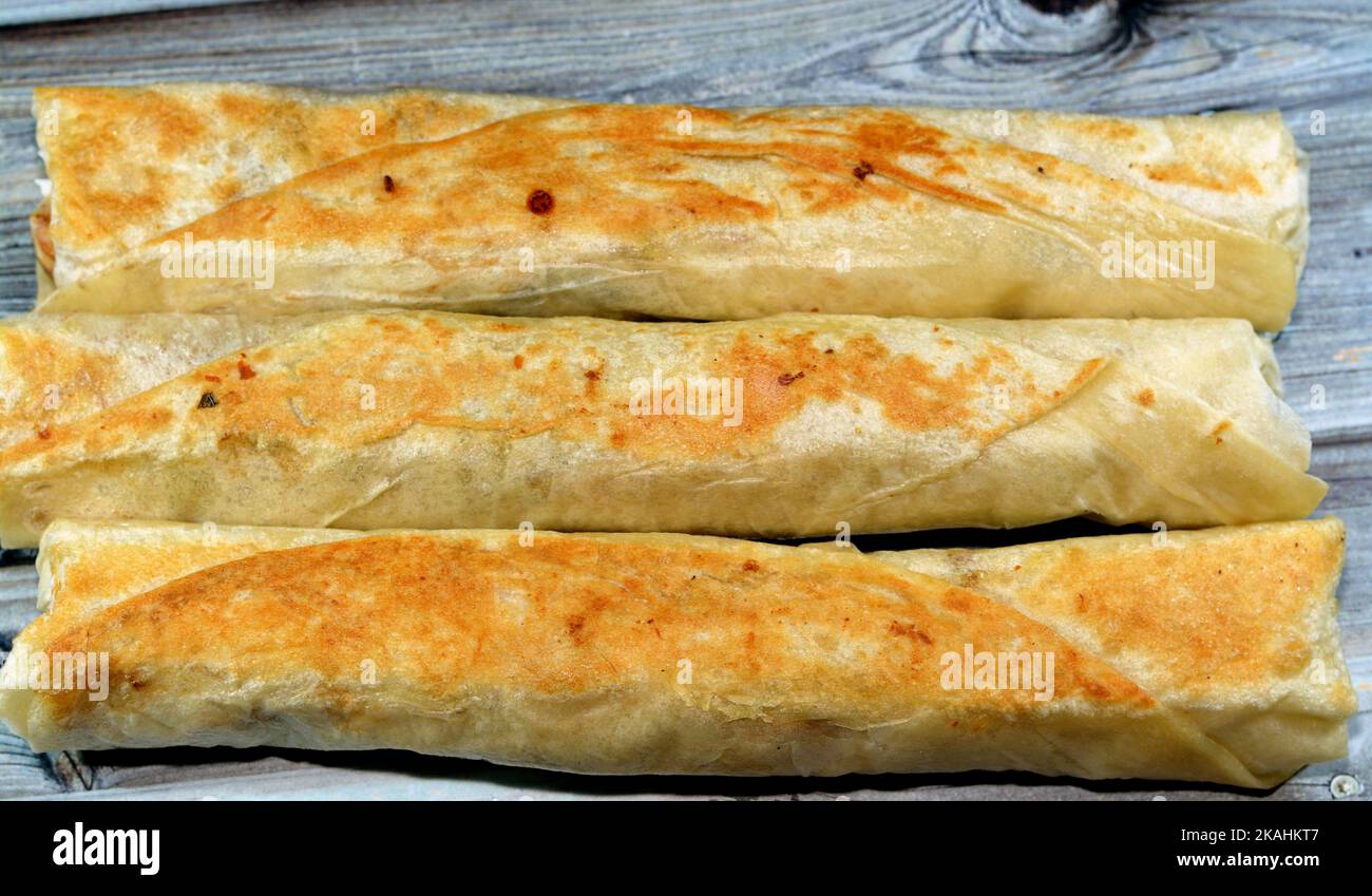 Syrian recipe cuisine background, chicken shawerma or shawarma tortilla ...