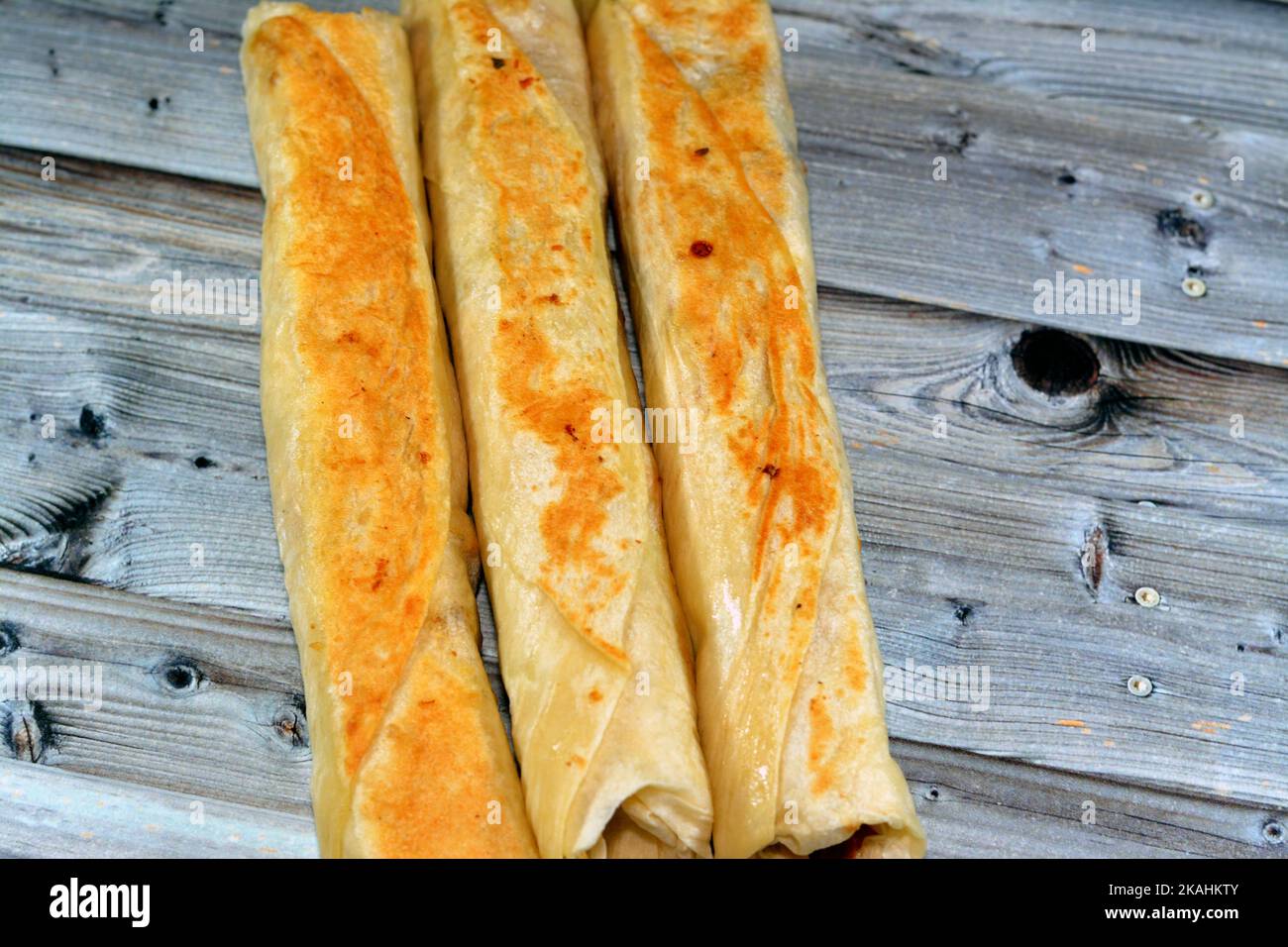 Syrian recipe cuisine background, chicken shawerma or shawarma tortilla ...