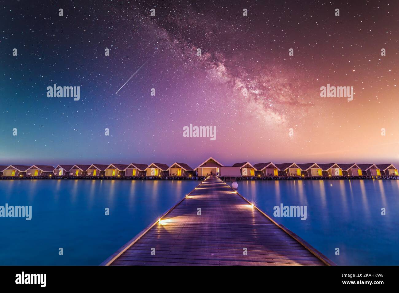 Luxury over water villas, bungalows sea ocean with beach at night ...