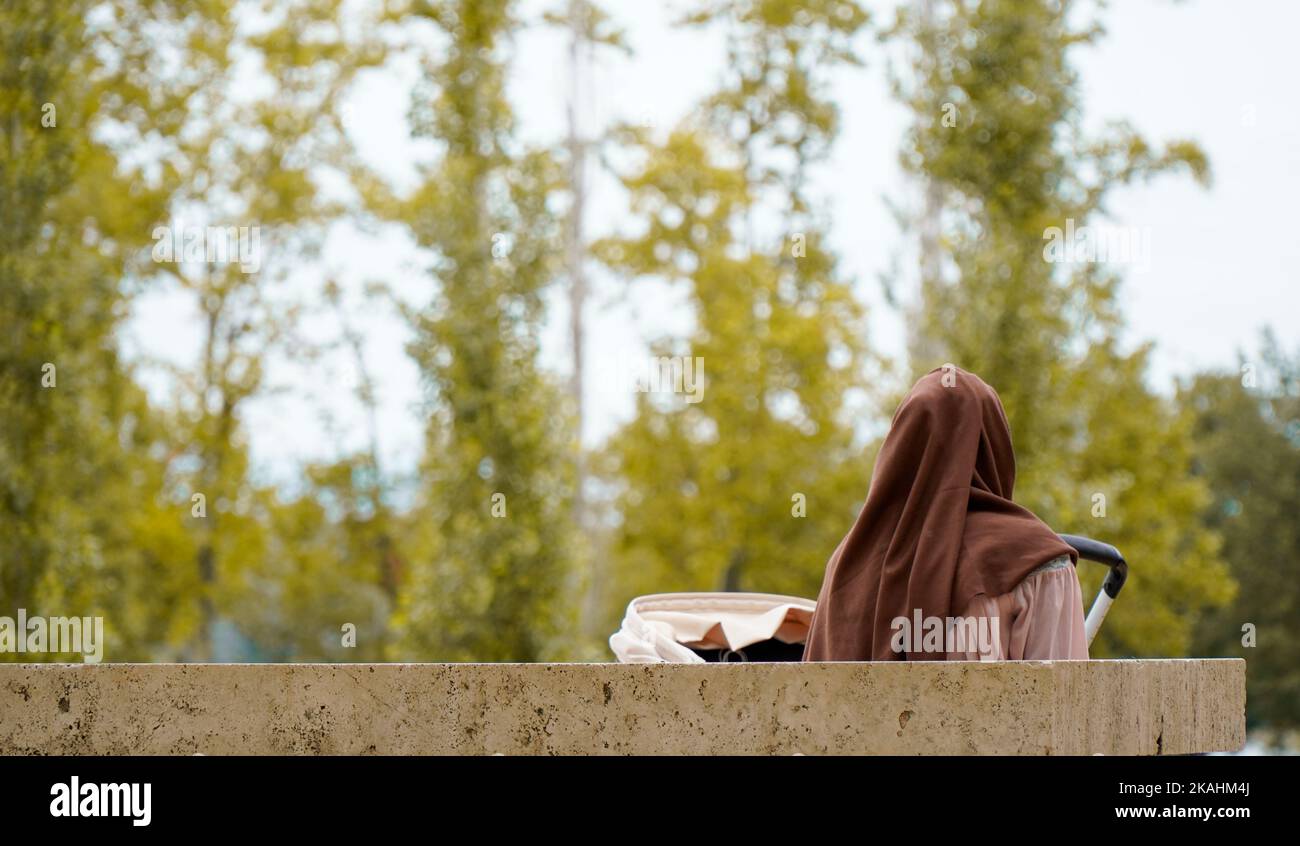 Back view arabian mother hi-res stock photography and images - Alamy